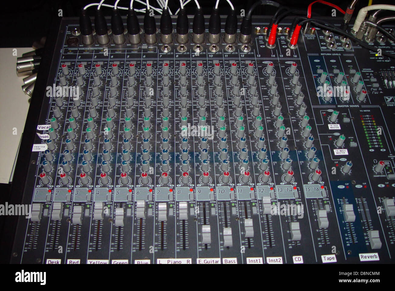 A twelve-channel mixing desk, commonly used in audio production or ...