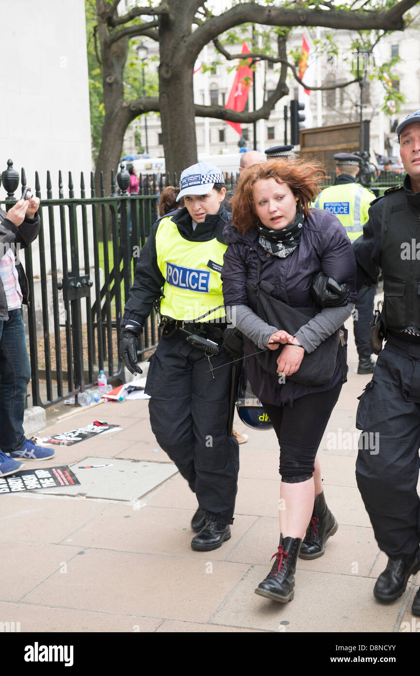 Protester arrested protester handcuffed hi-res stock photography and ...