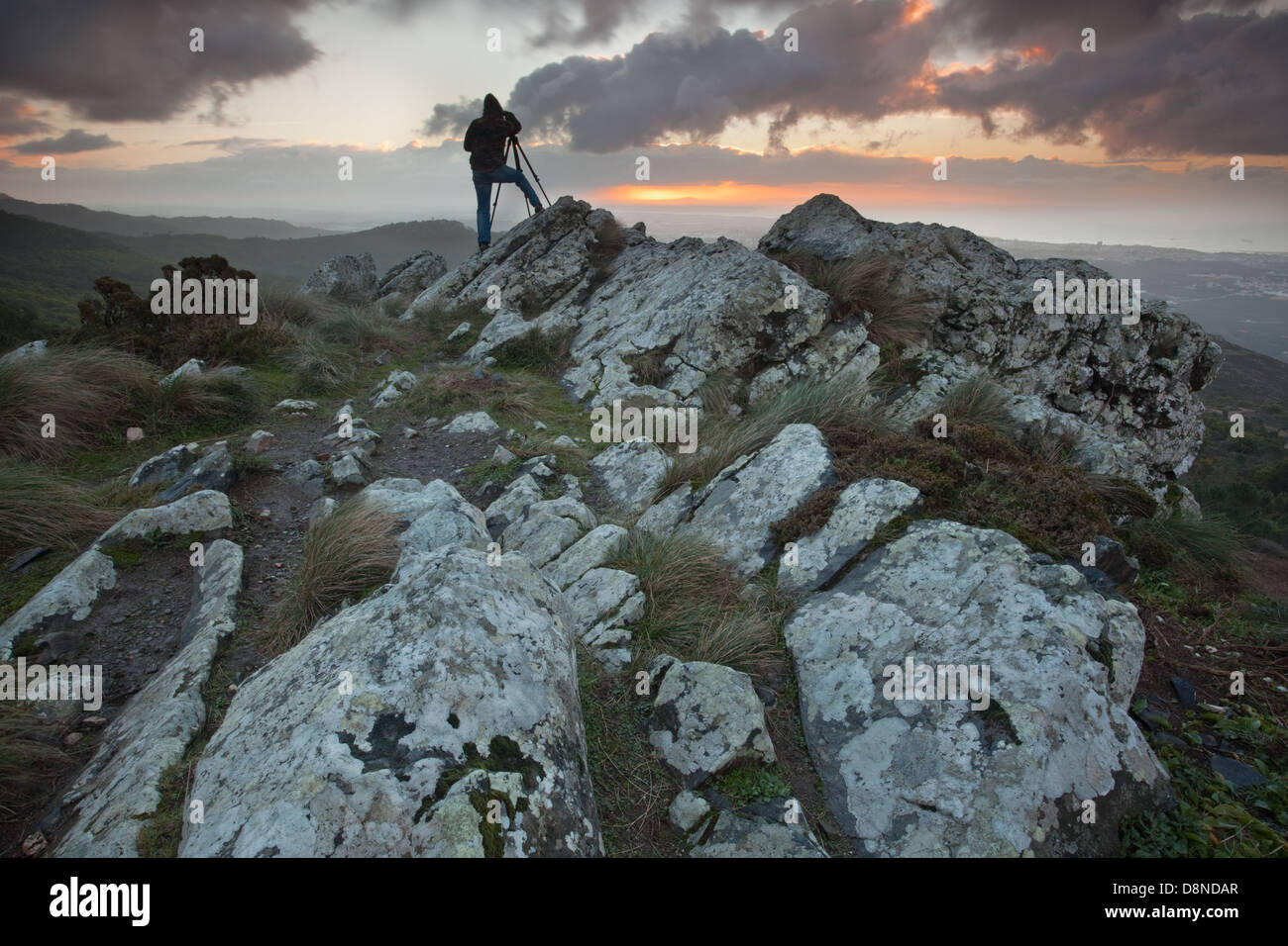 Men photographing the landscape at sunrise Stock Photo - Alamy