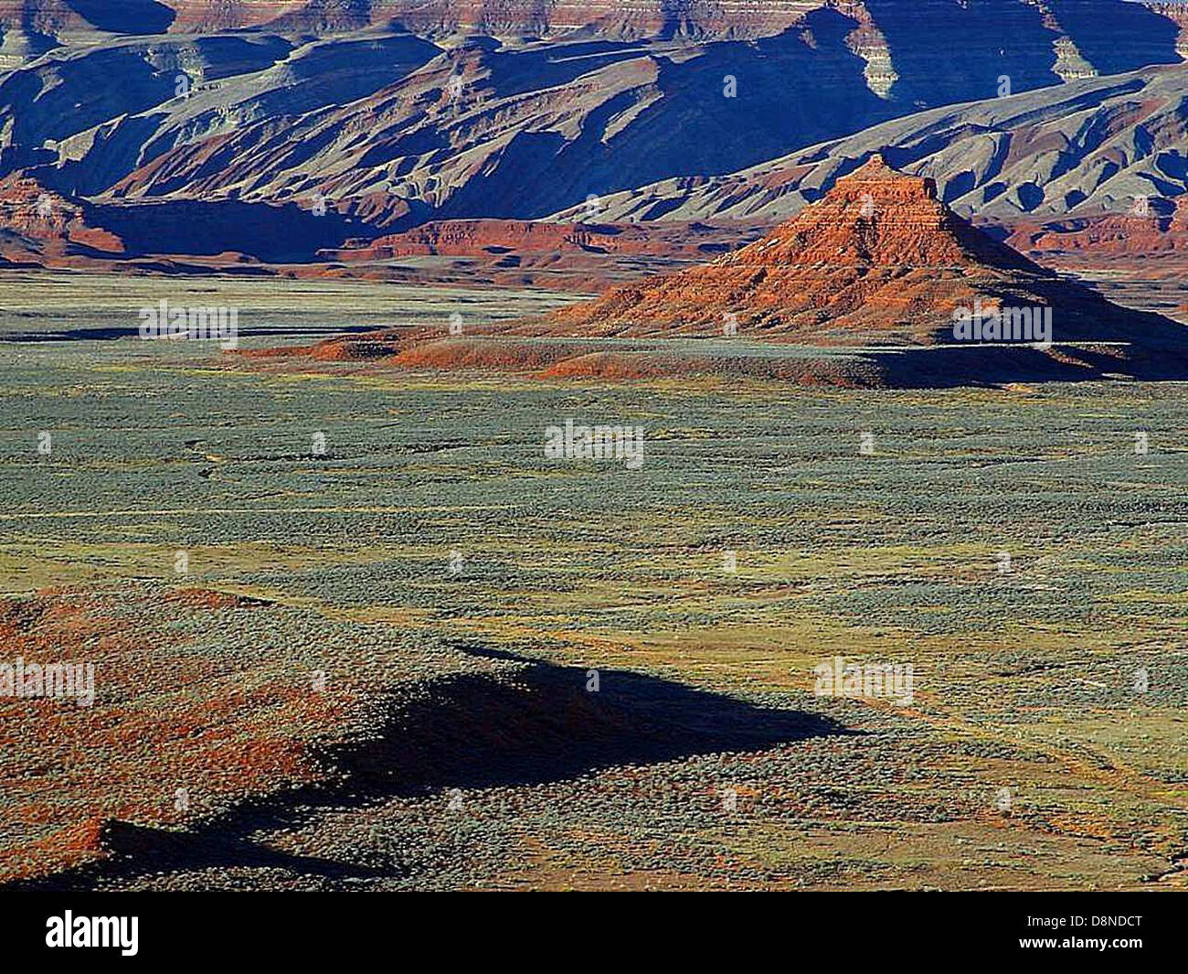 A wide-angle view of a valley in Utah. The landscape features distant ...