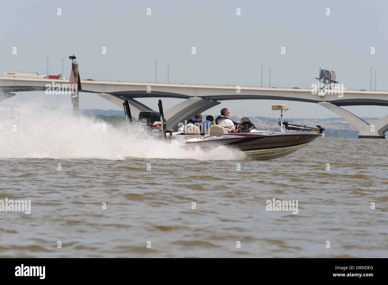 A high-speed motorboat racing across the water, showcasing the ...