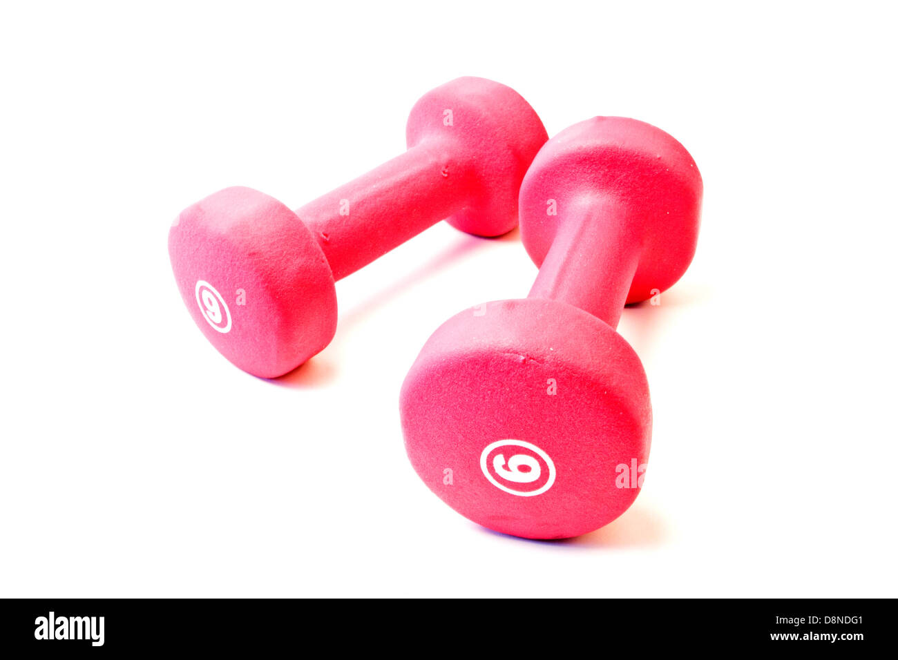 A pair of pink weights is seen against a white background Stock Photo ...