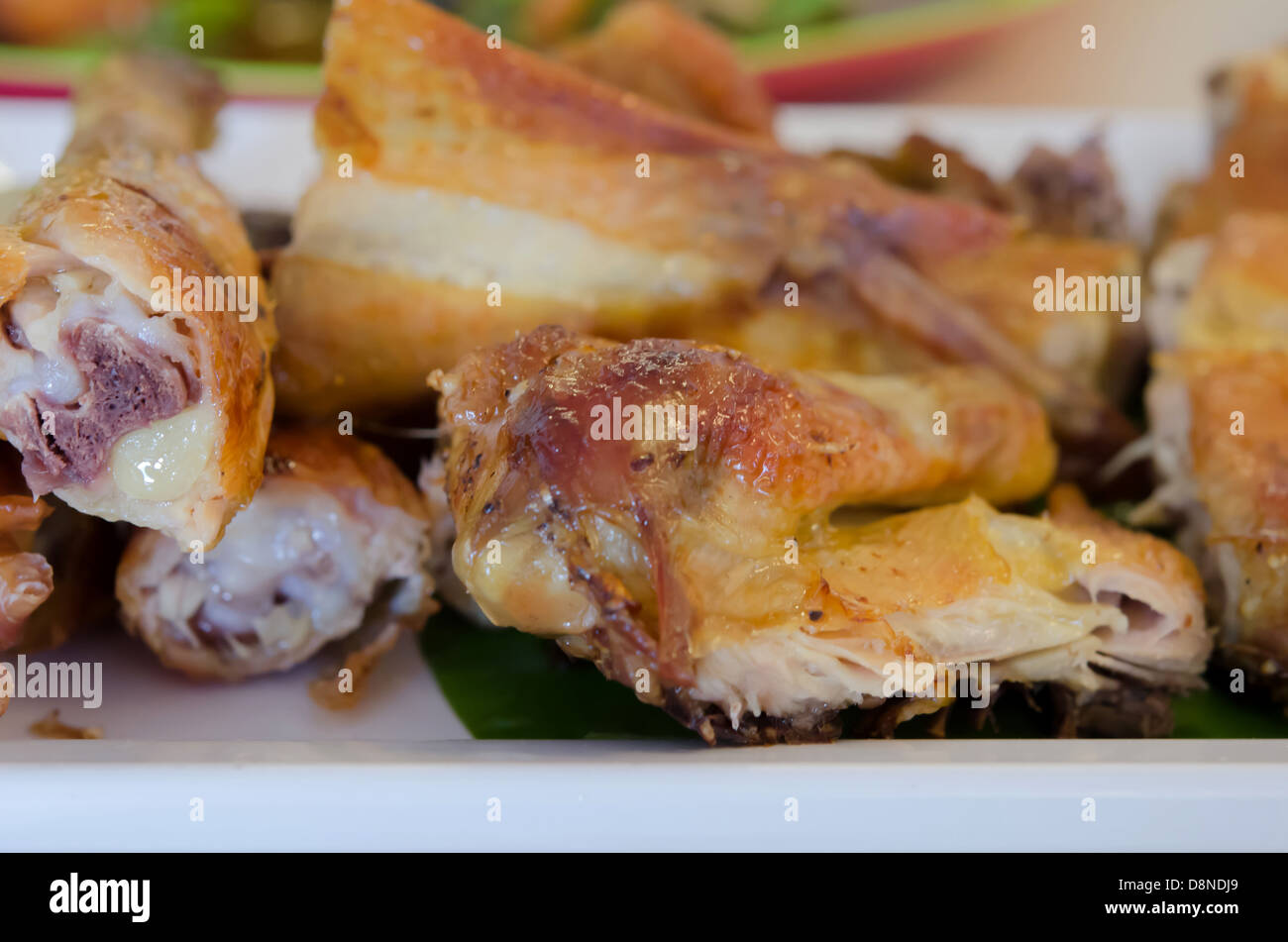 close up grilled chicken on white plate Stock Photo - Alamy