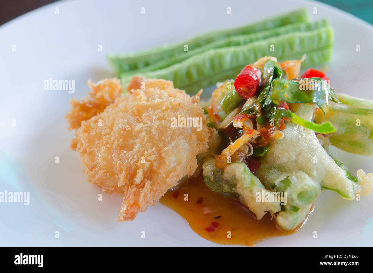 close up crispy shrimp and crispy vegetable served with chili sauce and ...