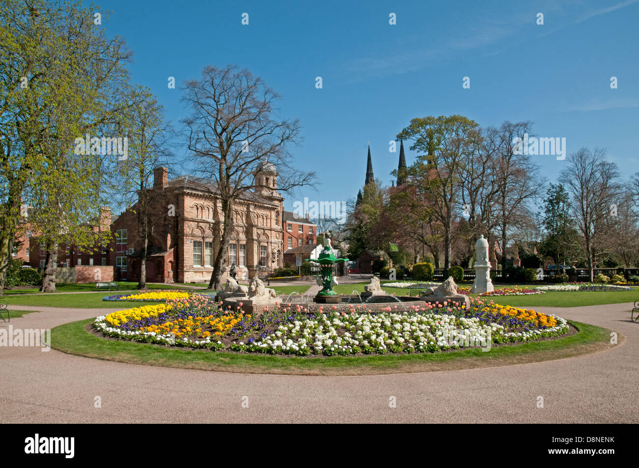 Flower beds and fountain in Beacon Park Gardens Lichfield with Old free ...