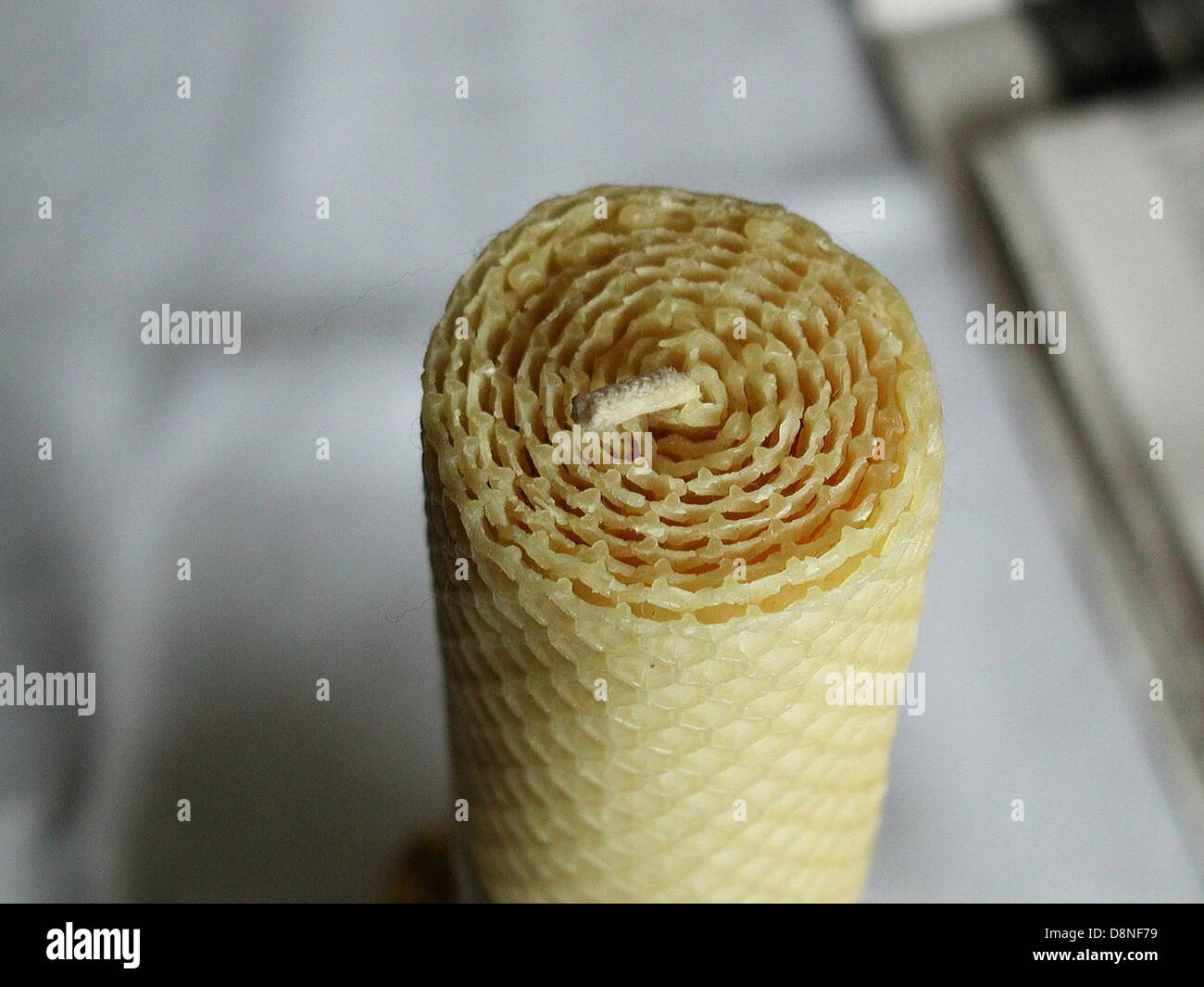 A detailed image of a wax candle, showing the texture of the wax and ...