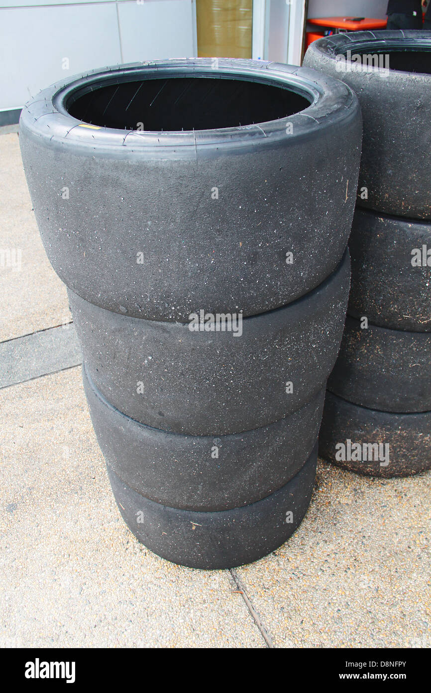 Stack of worn racing tyres Stock Photo - Alamy