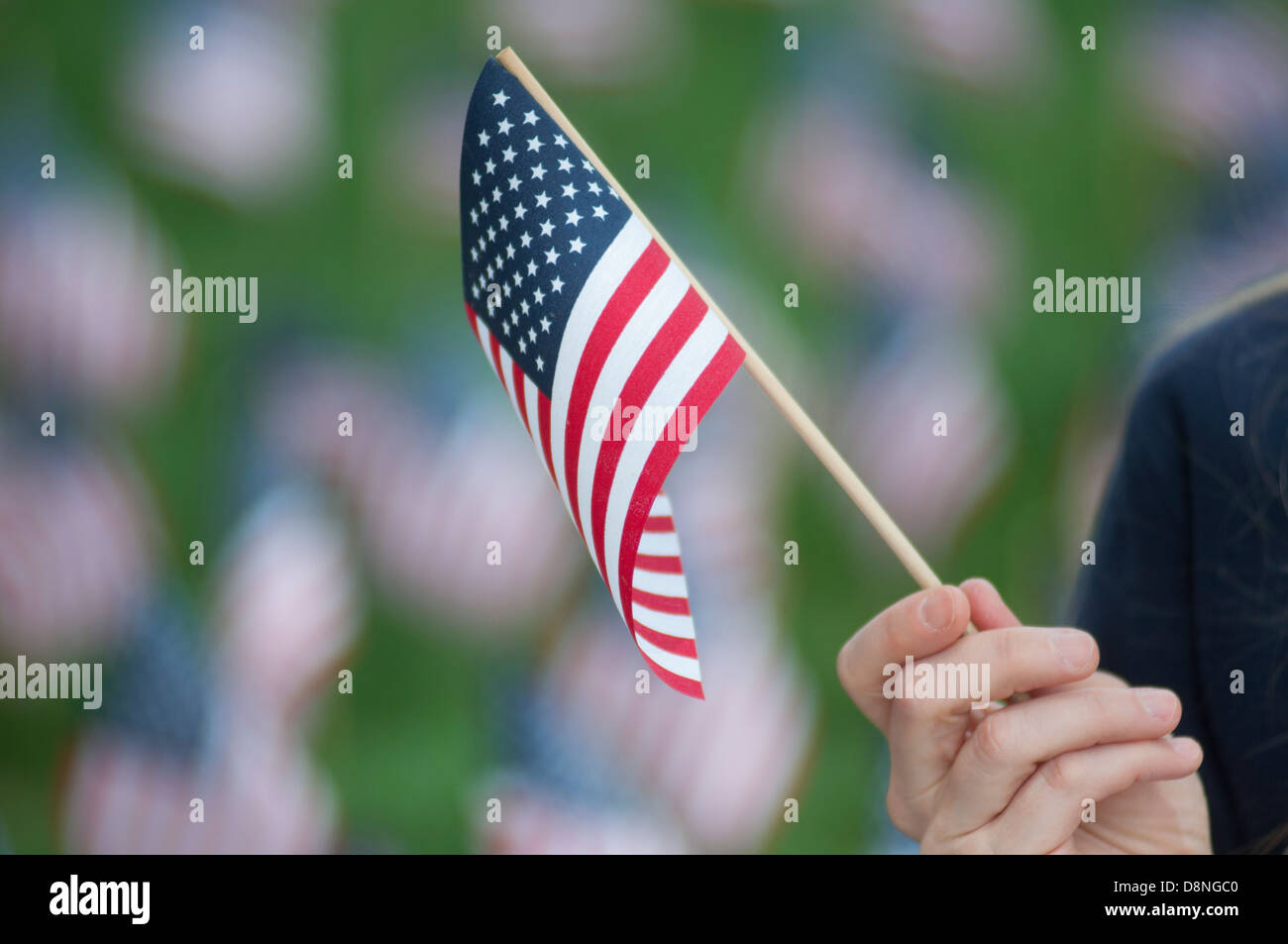 Hand waving small United States flag Stock Photo - Alamy
