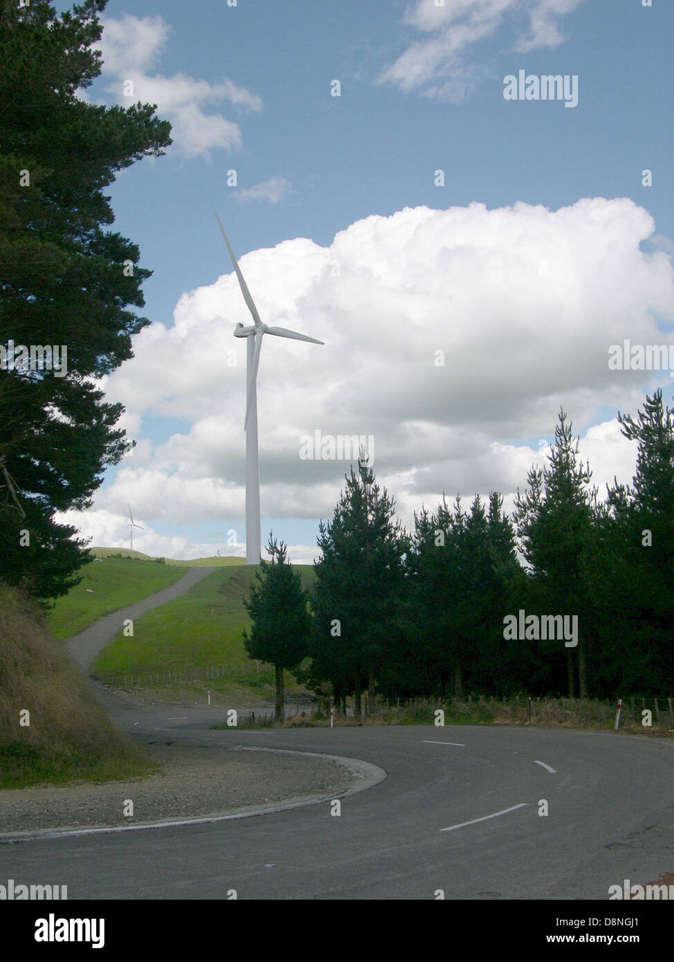 A wind power generator standing tall against the sky, harnessing wind energy to generate ...