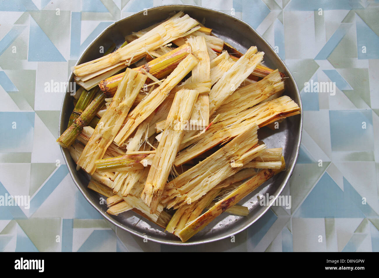 Crushed sugar cane in a aluminium tray waiting to be boiled Stock Photo ...