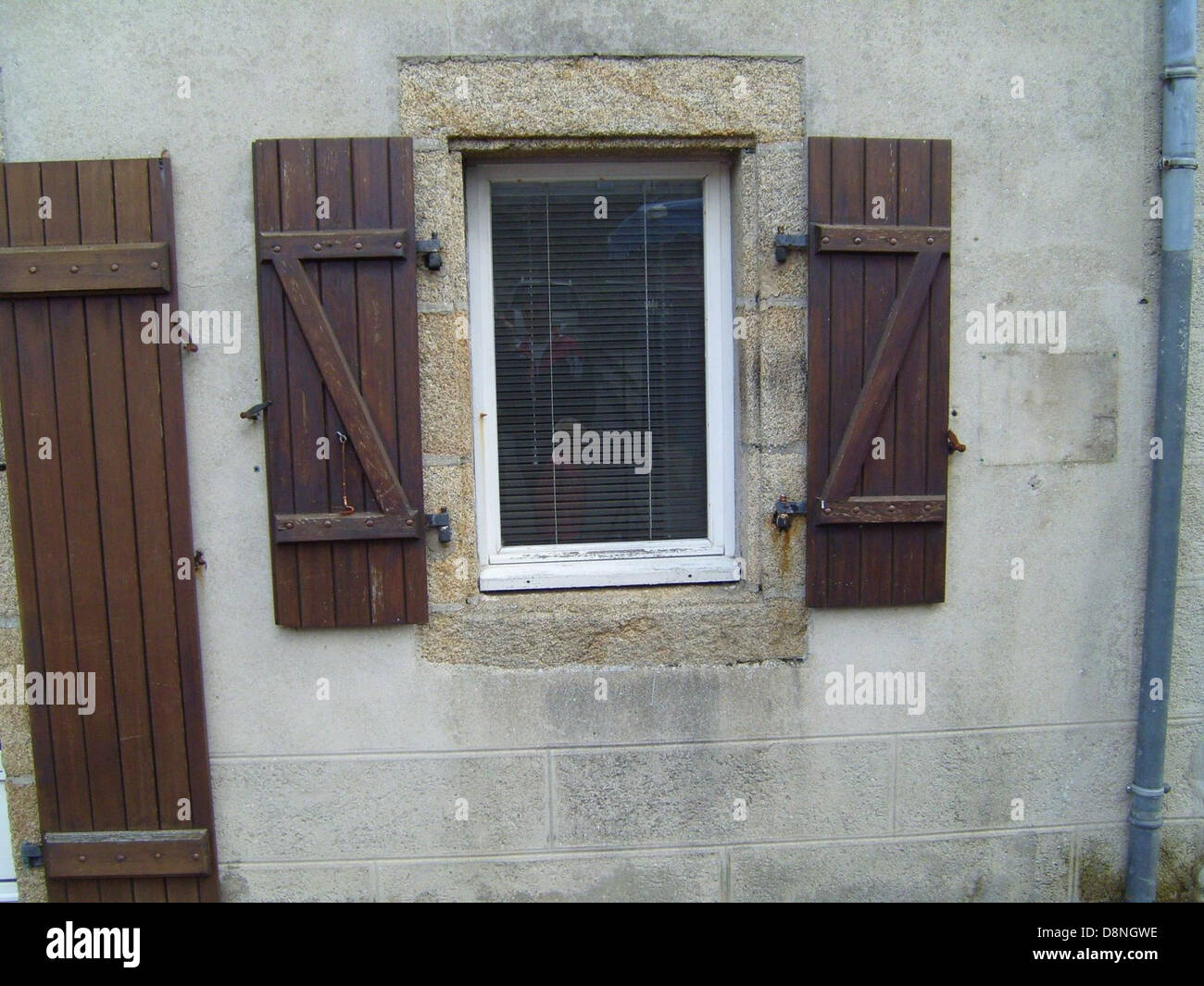 An old-fashioned wooden window with a rustic design, showing the charm ...