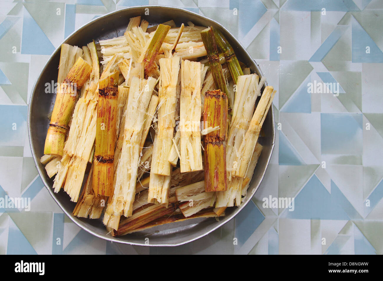 Crushed sugar cane in a aluminium tray waiting to be boiled Stock Photo ...