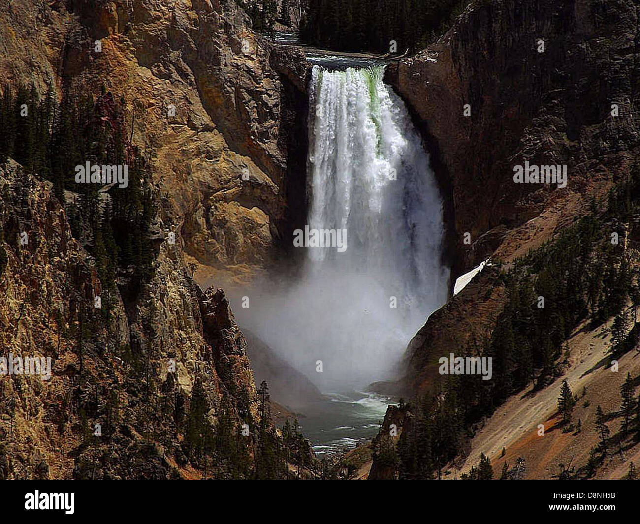 The Lower Falls of Yellowstone, a dramatic waterfall located in ...