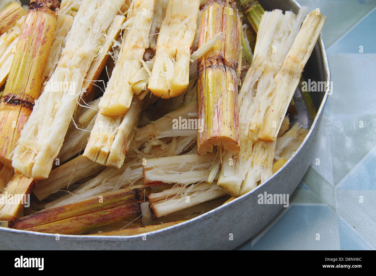 Crushed sugar cane in a aluminium tray waiting to be boiled Stock Photo ...