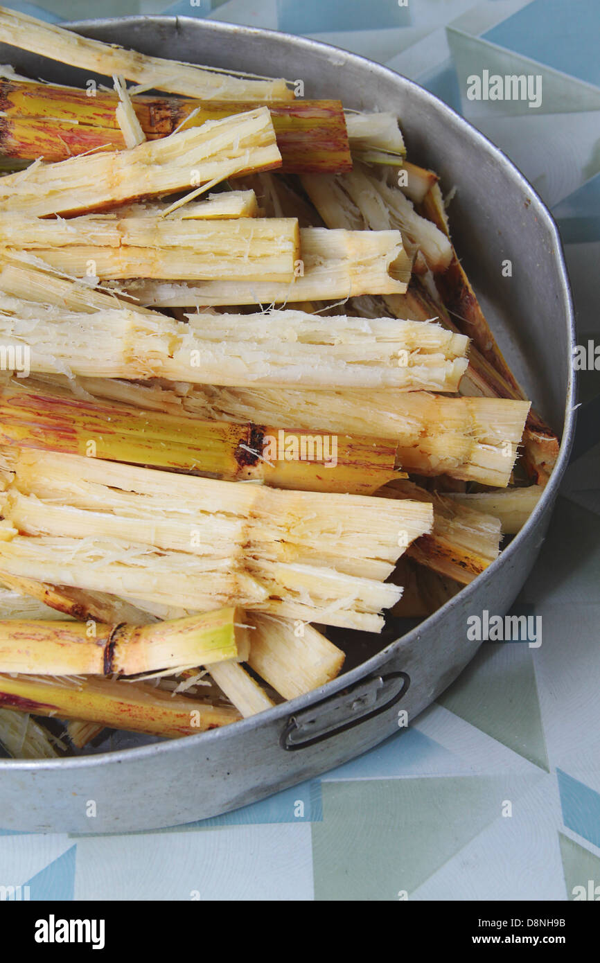 Crushed sugar cane in a aluminium tray waiting to be boiled Stock Photo ...