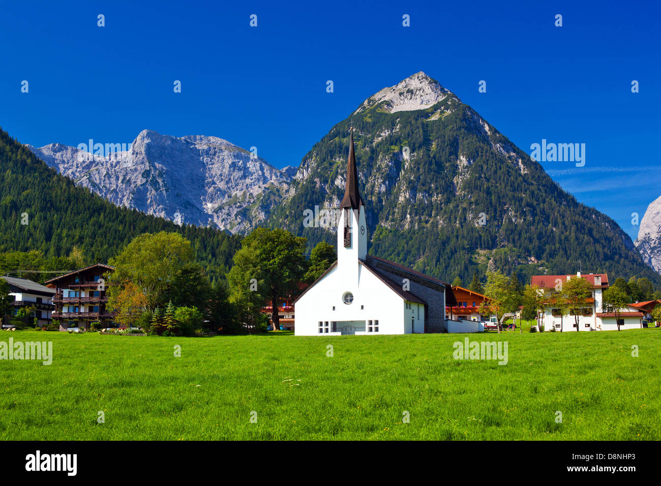 Alps village with cathedral landscape Stock Photo - Alamy