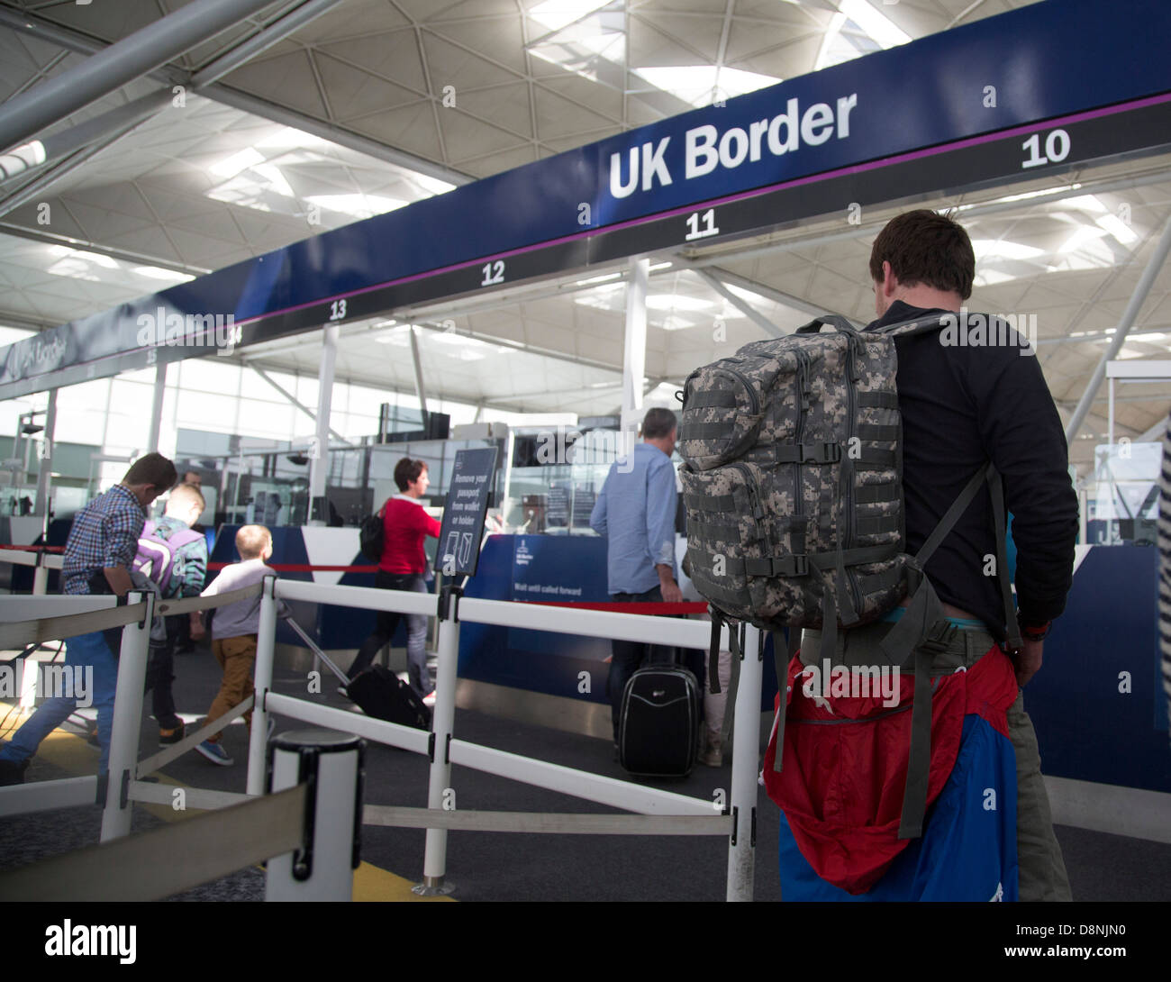 UK Border Stansted queue airport passports Stock Photo - Alamy