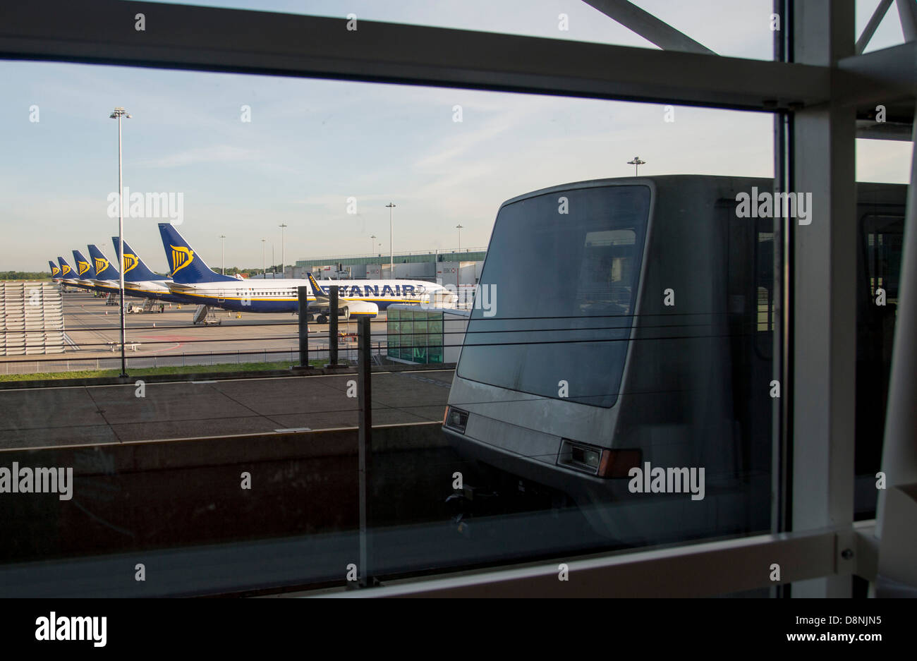 Stansted airport shuttle train Ryanair planes tarmac Stock Photo - Alamy