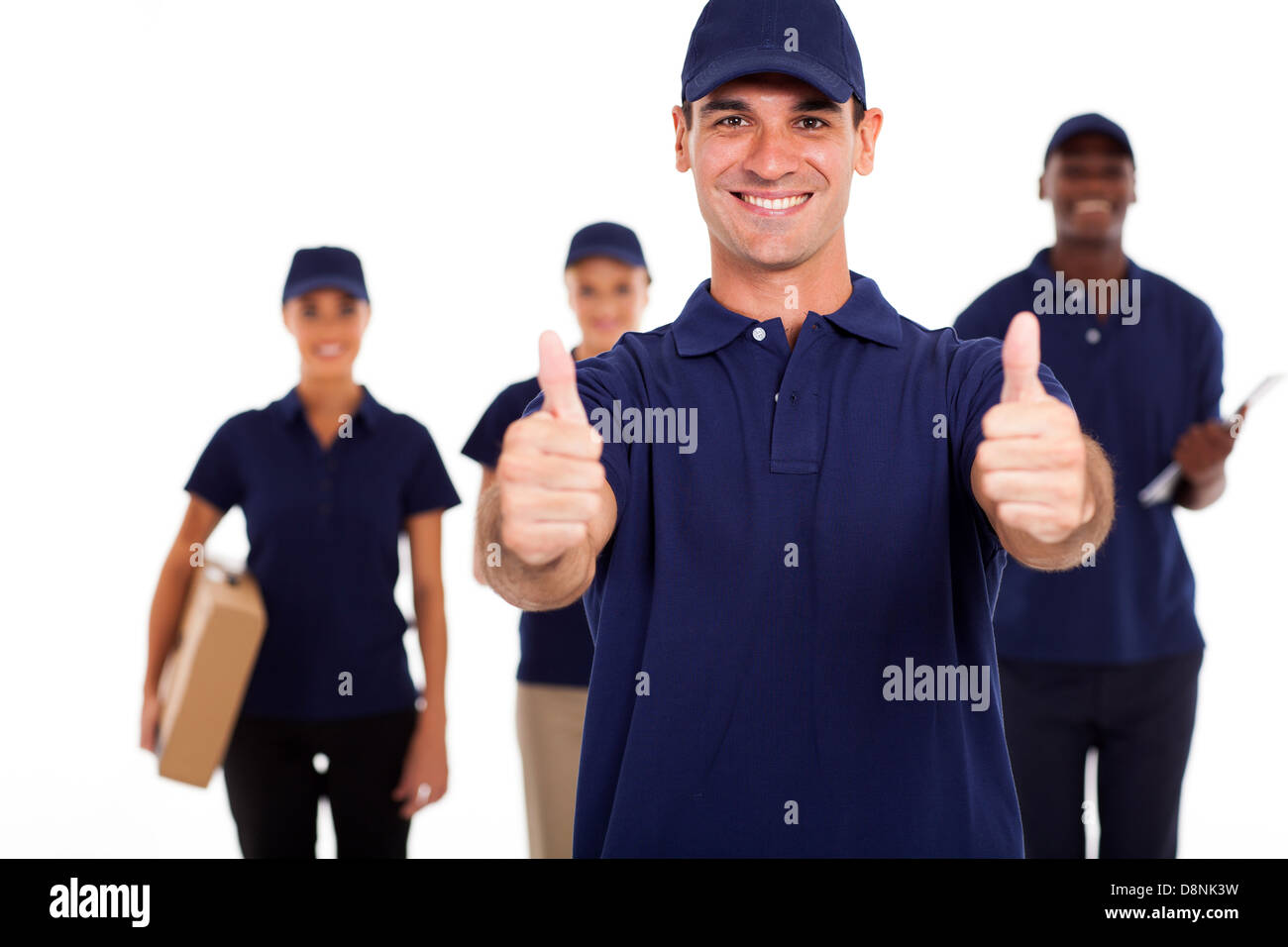 IT technician giving two thumbs up in front of colleagues Stock Photo ...
