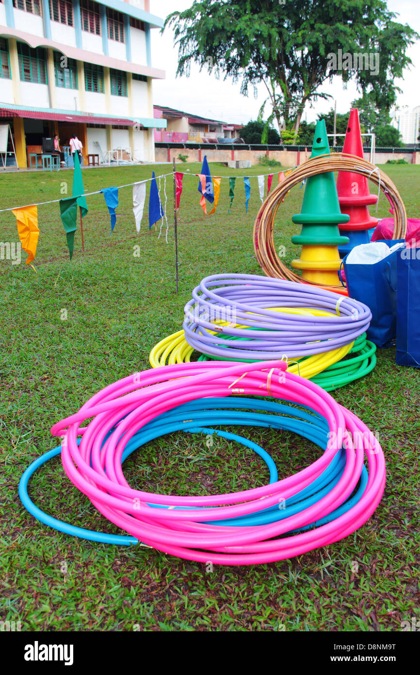 Kid playground items such hula hoops and cones Stock Photo - Alamy