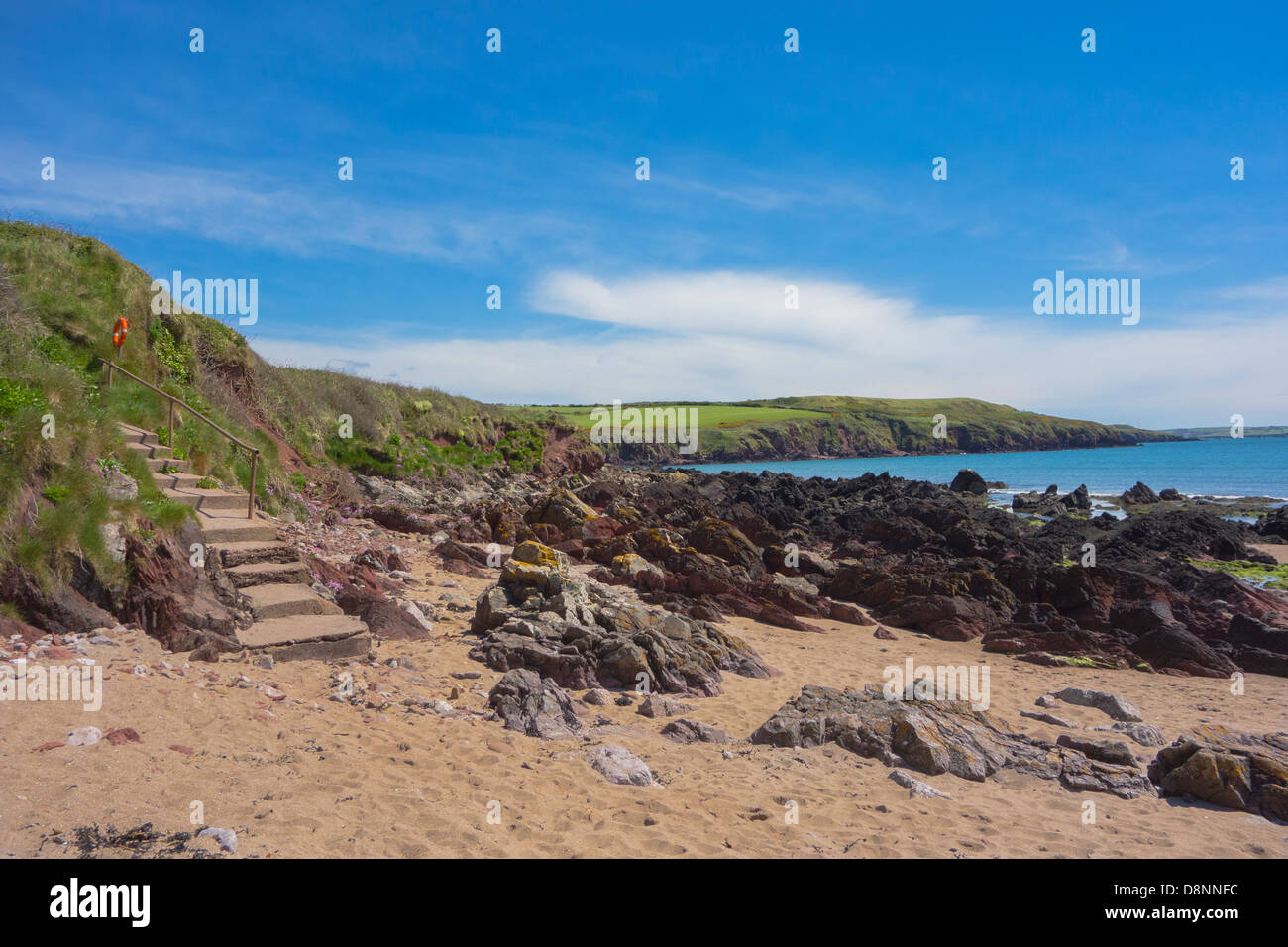 Steps leading down onto Sandy Haven beach on the Pembrokeshire Coast ...
