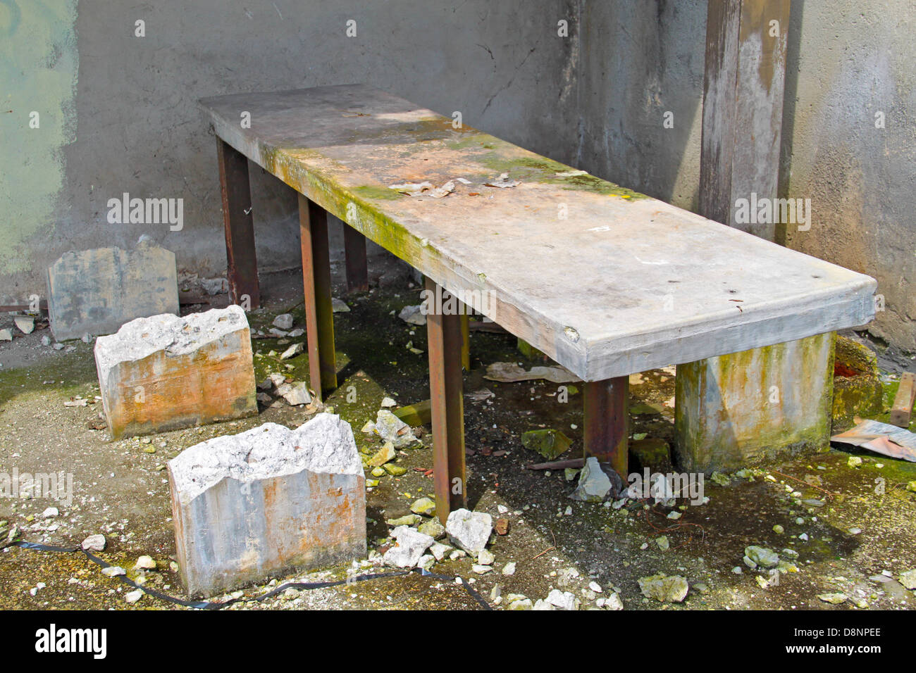 Messy abandoned table slab Stock Photo - Alamy