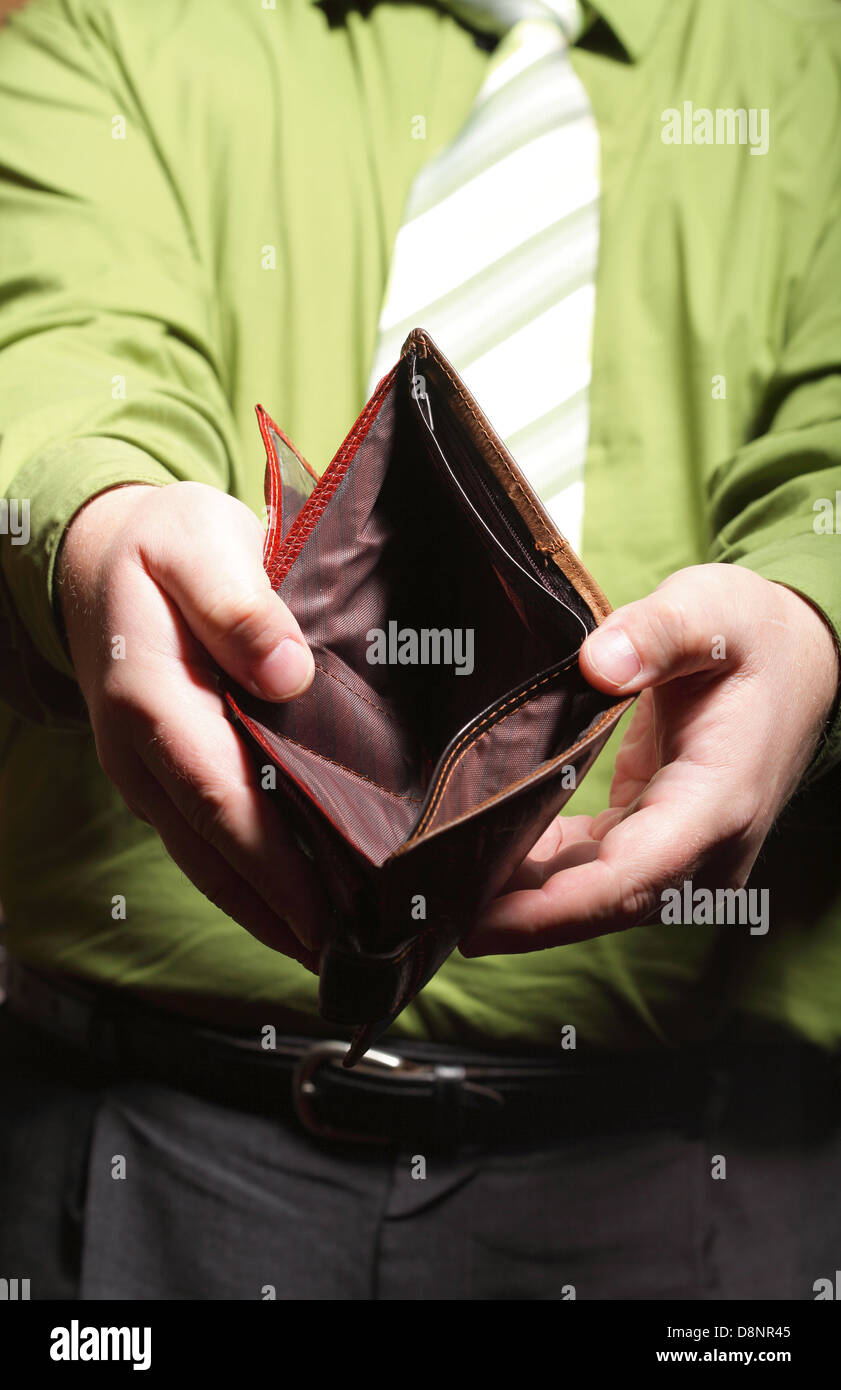 Poor economy represented by empty wallet in businessman's hands Stock ...