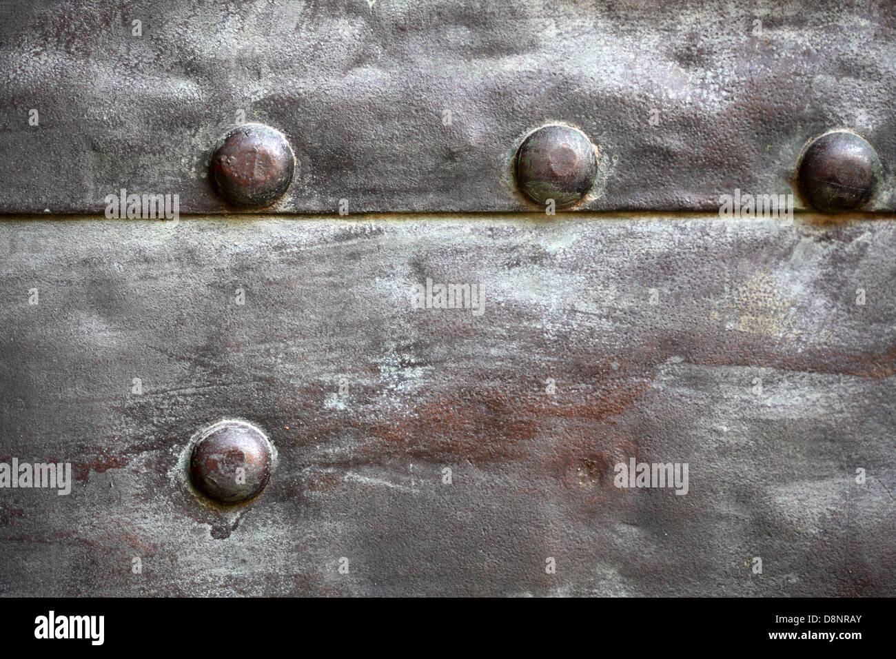 Black grunge metal plate or armour texture with rivets as background ...