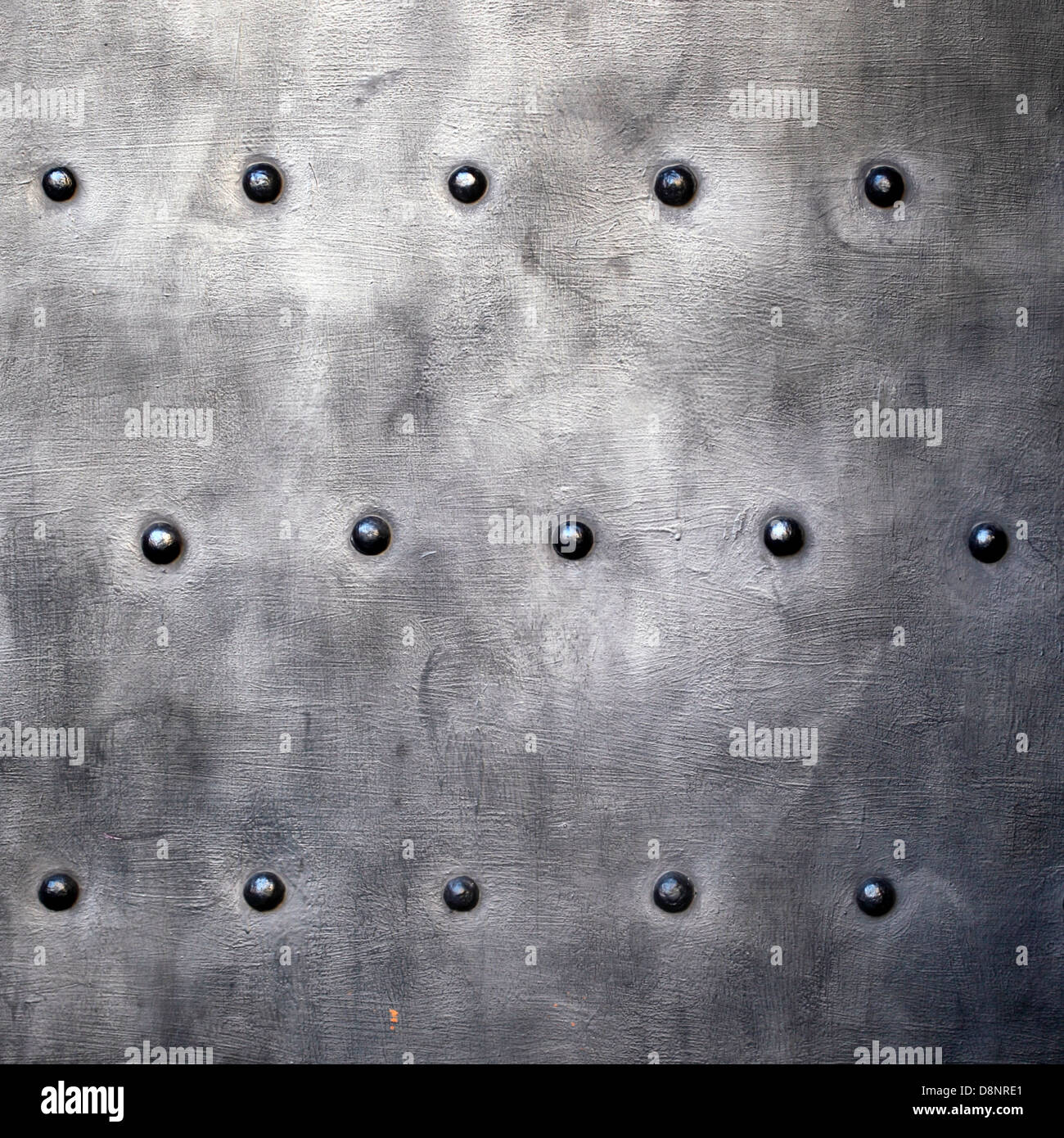 Black grunge metal plate or armour texture with rivets as background ...