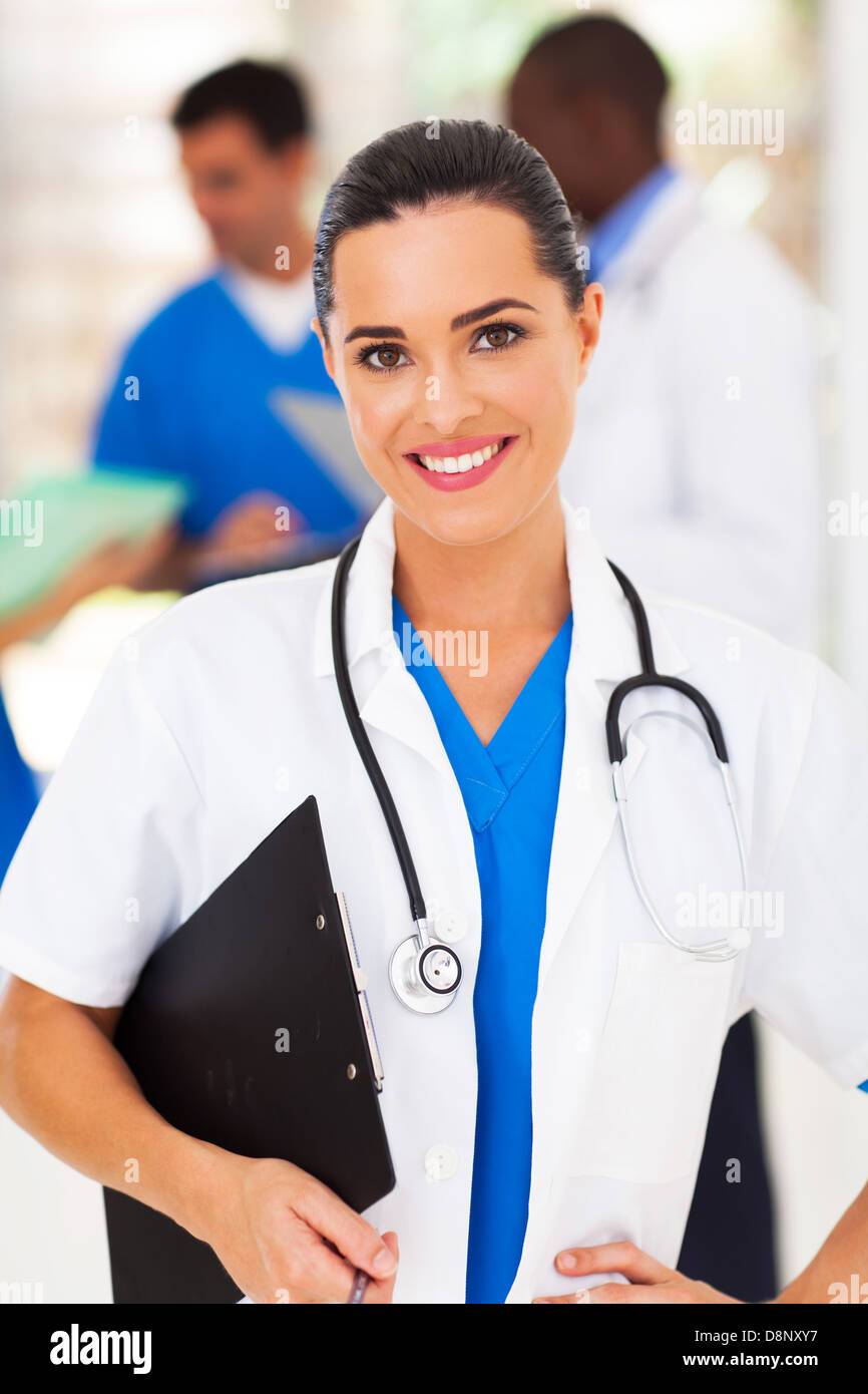 pretty female medical worker in front of colleagues Stock Photo - Alamy
