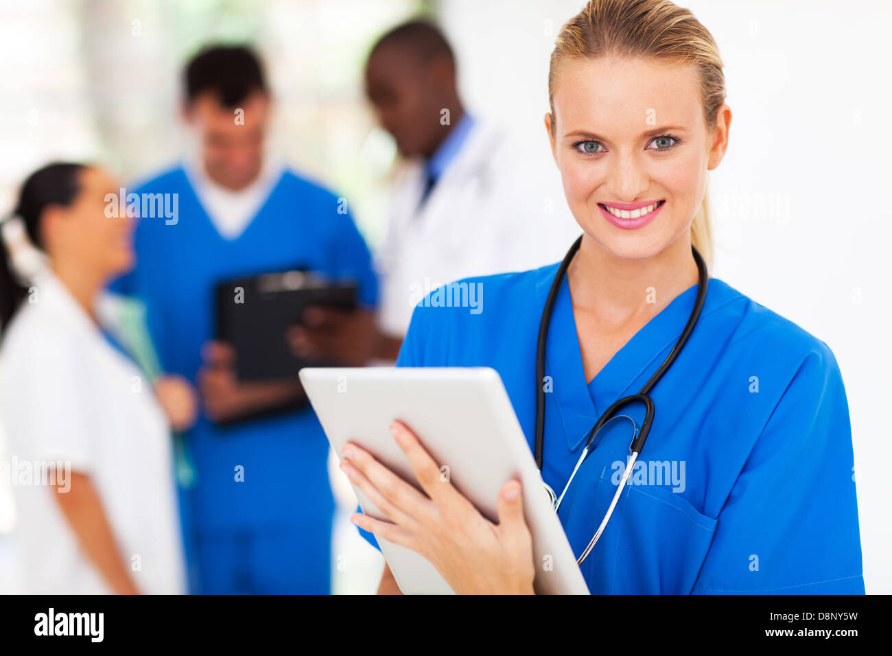 pretty medical nurse with tablet computer in hospital Stock Photo - Alamy