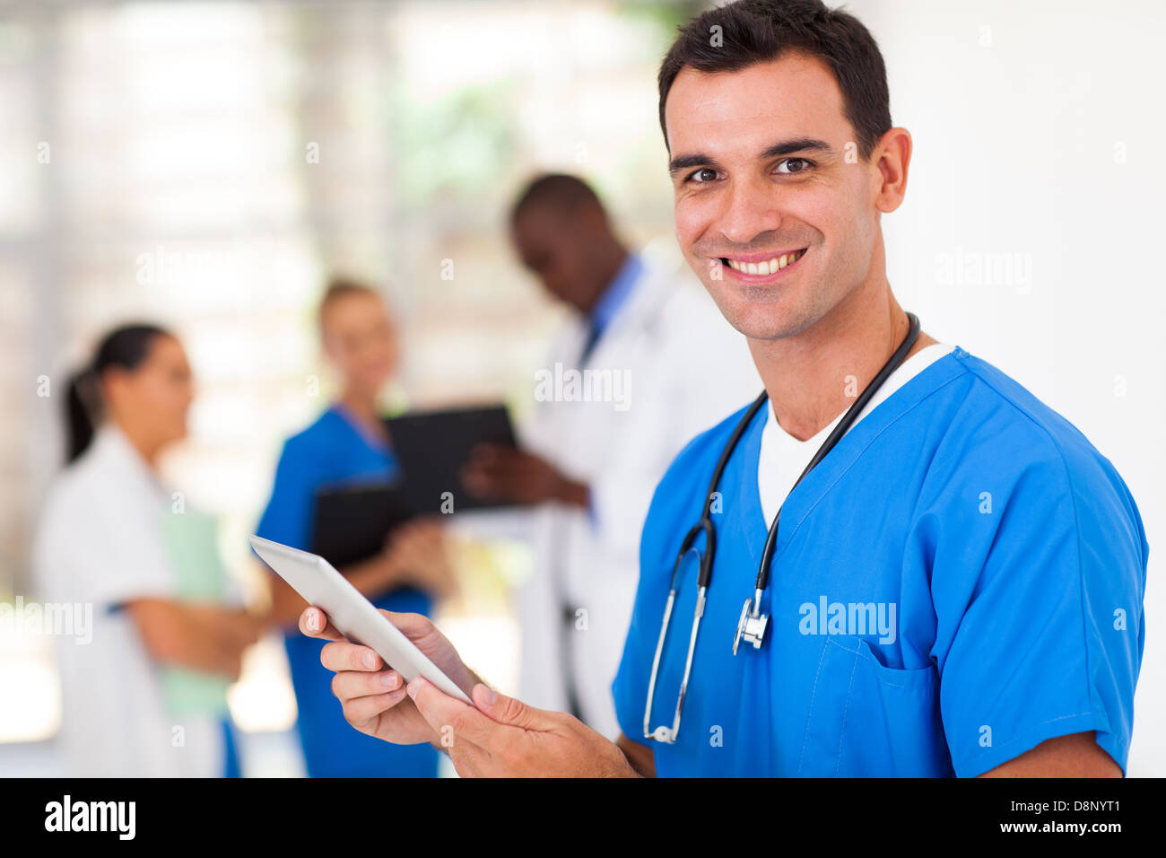 handsome medical surgeon with tablet computer in hospital Stock Photo ...