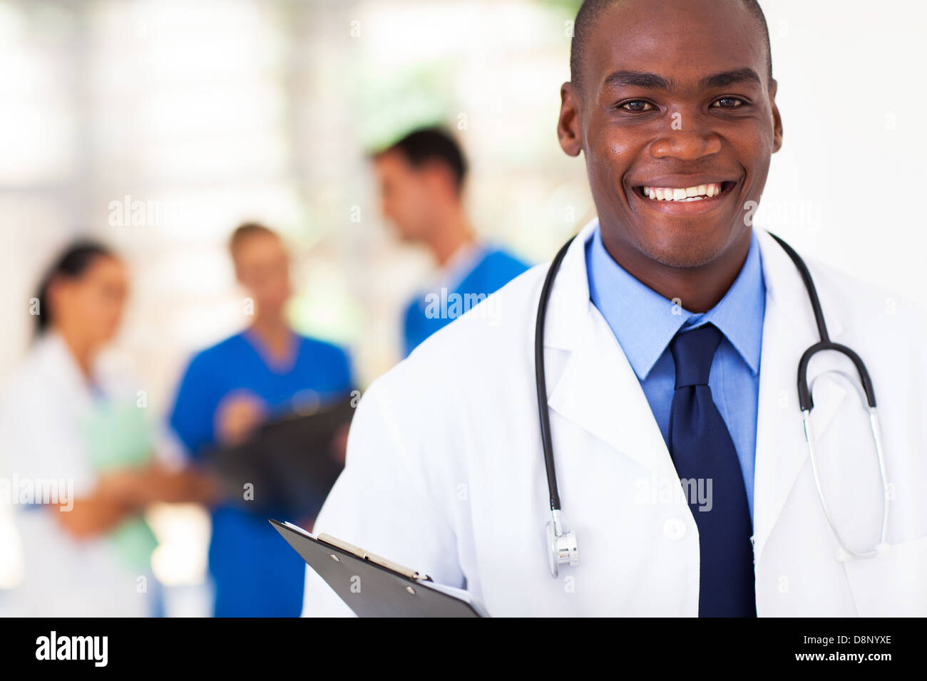 handsome African American medical doctor with colleagues in background ...