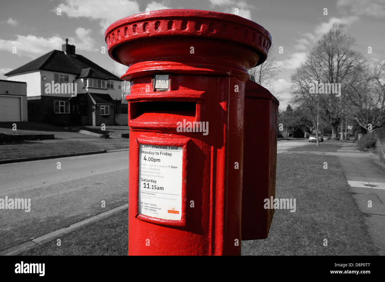 A traditional British post box in a suburban street, standing out ...