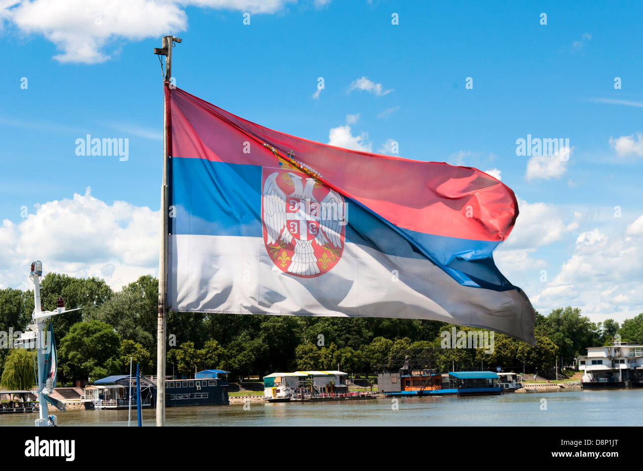 Official Serbian flag over the sky Stock Photo - Alamy