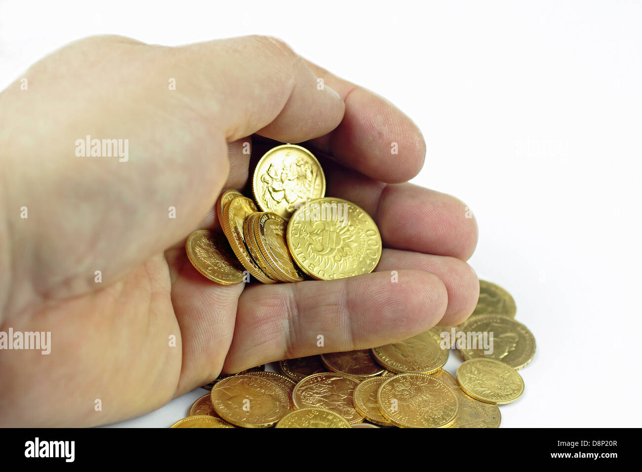 Hand with gold coins Stock Photo - Alamy
