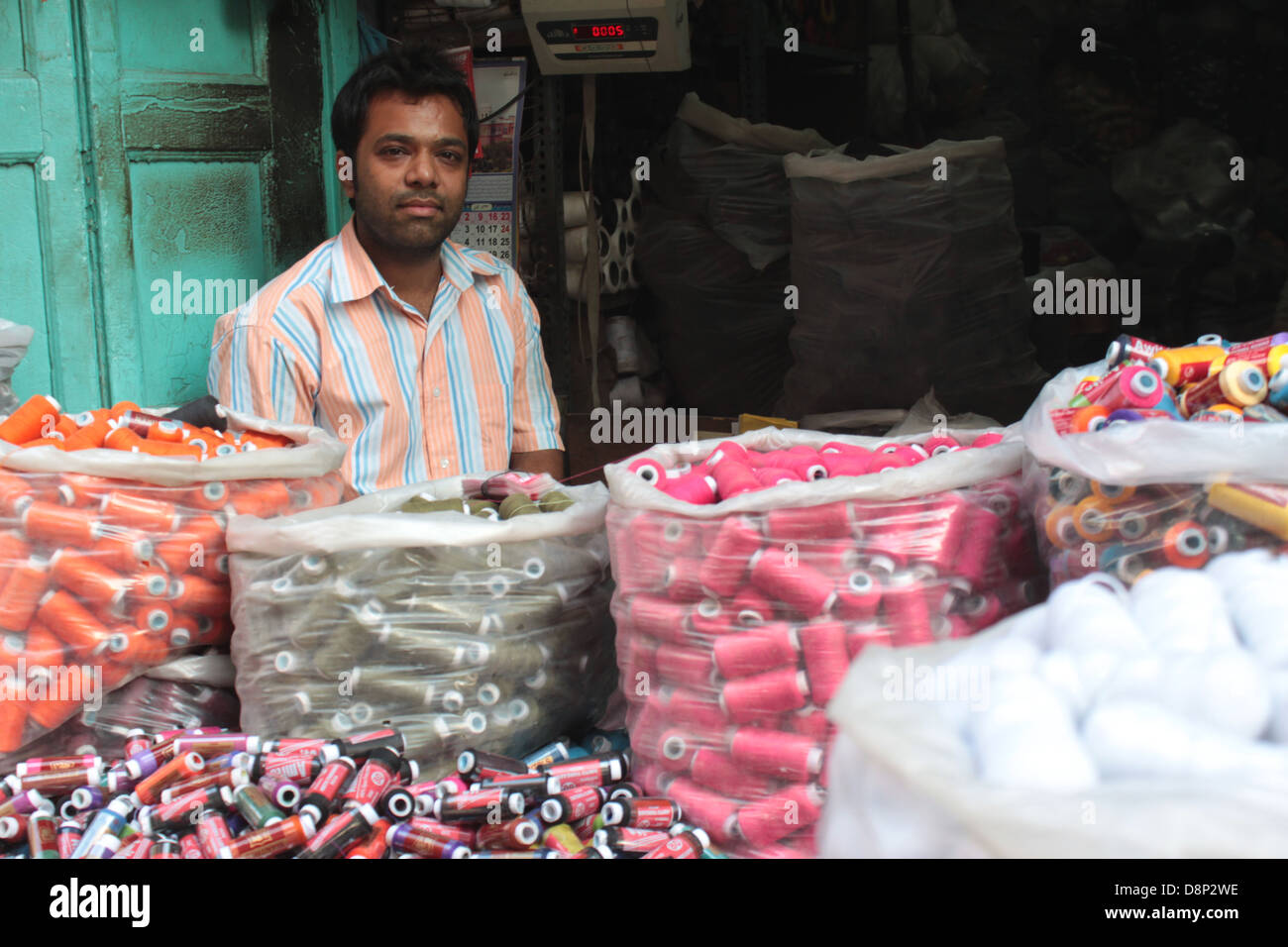 A man sells threads in Old Delhi, India Stock Photo - Alamy