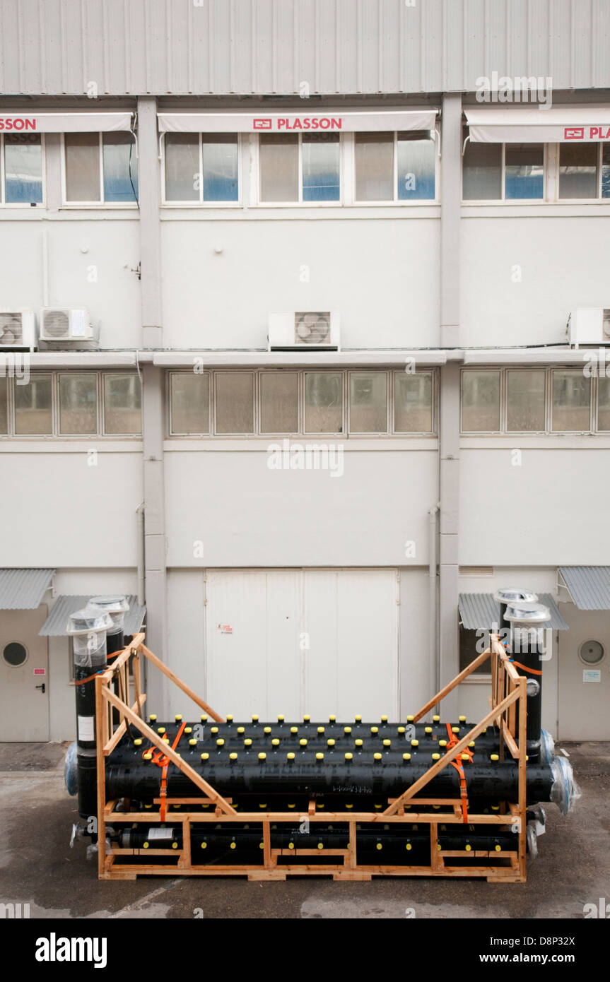 A pallet of plastic piping is waiting for shipping Stock Photo - Alamy