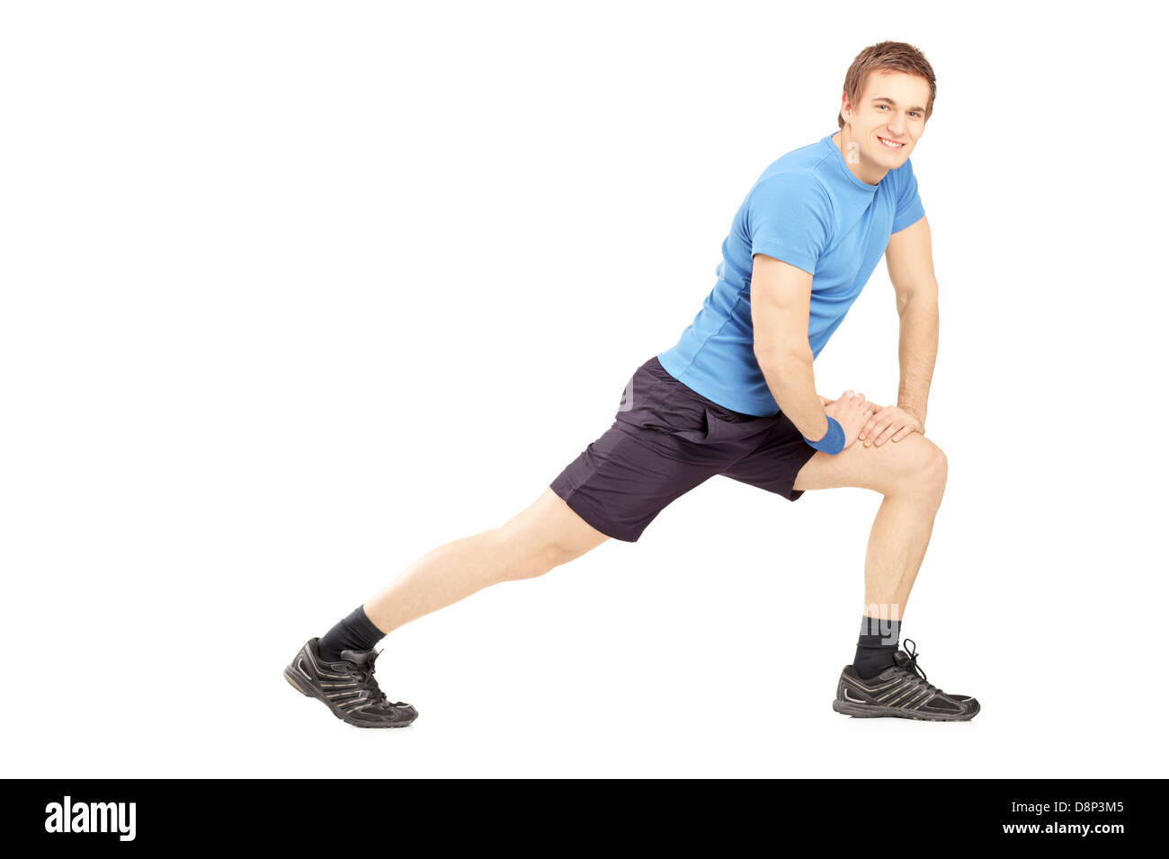 Full length portrait of a man exercising, isolated on white background ...
