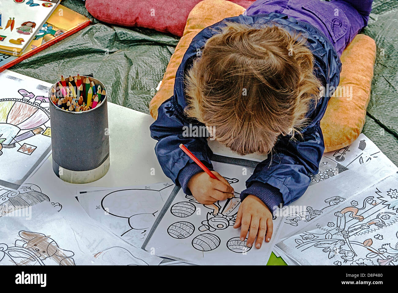 Child colored on the default drawings forms Stock Photo - Alamy