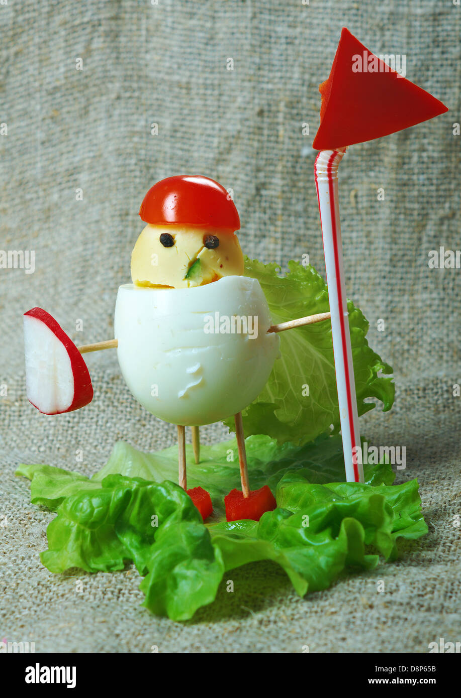 child breakfast. soldiermade from eggs, small radish,tomato Stock Photo ...