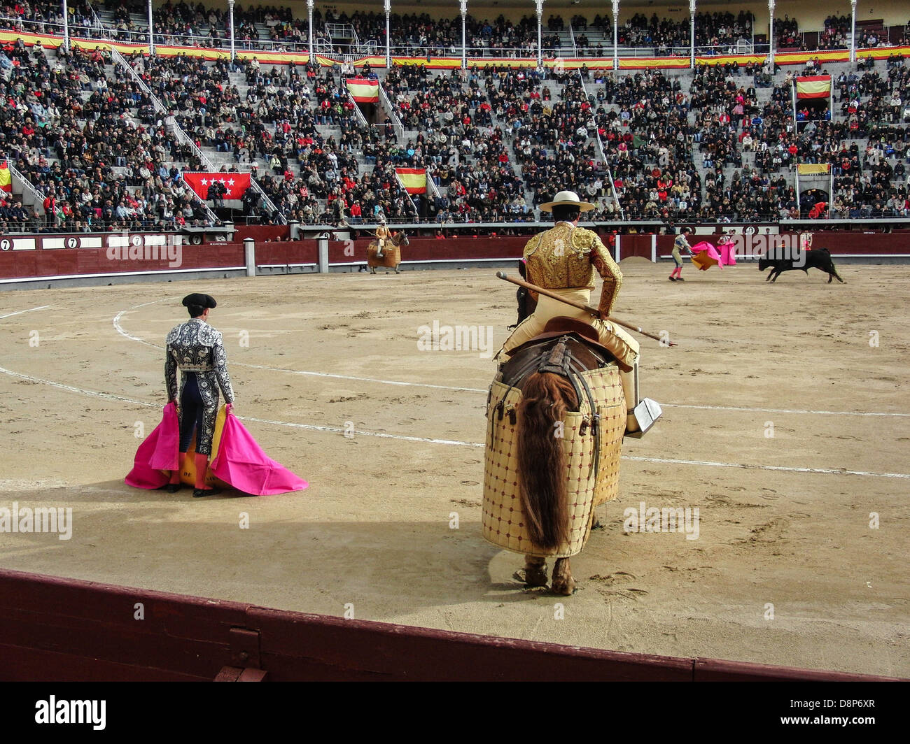 A matador performs in a bullfighting arena in Spain, showcasing the ...