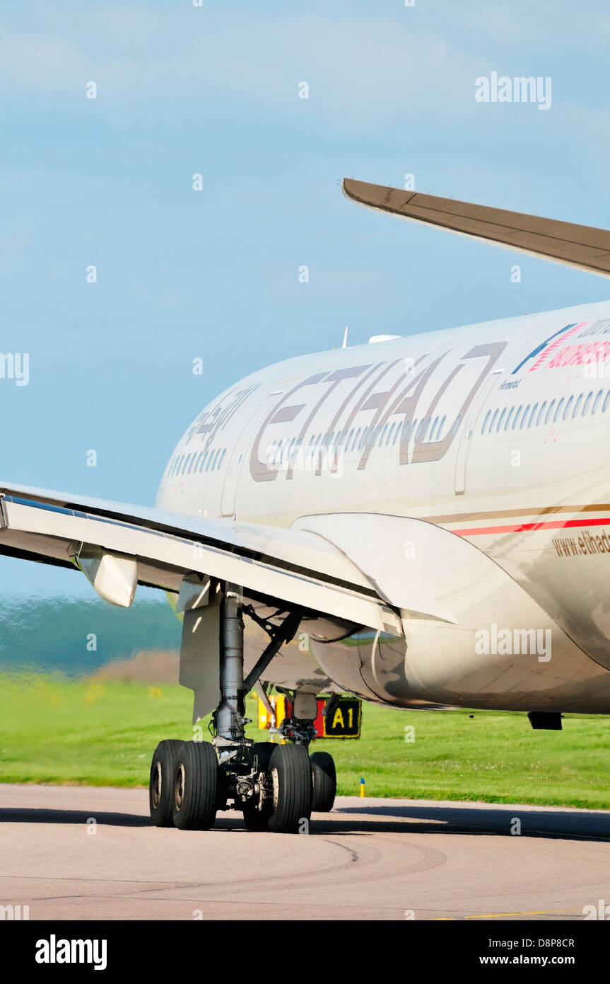 Rear view of undercarriage and side of an Etihad Airways Airbus A330 ...