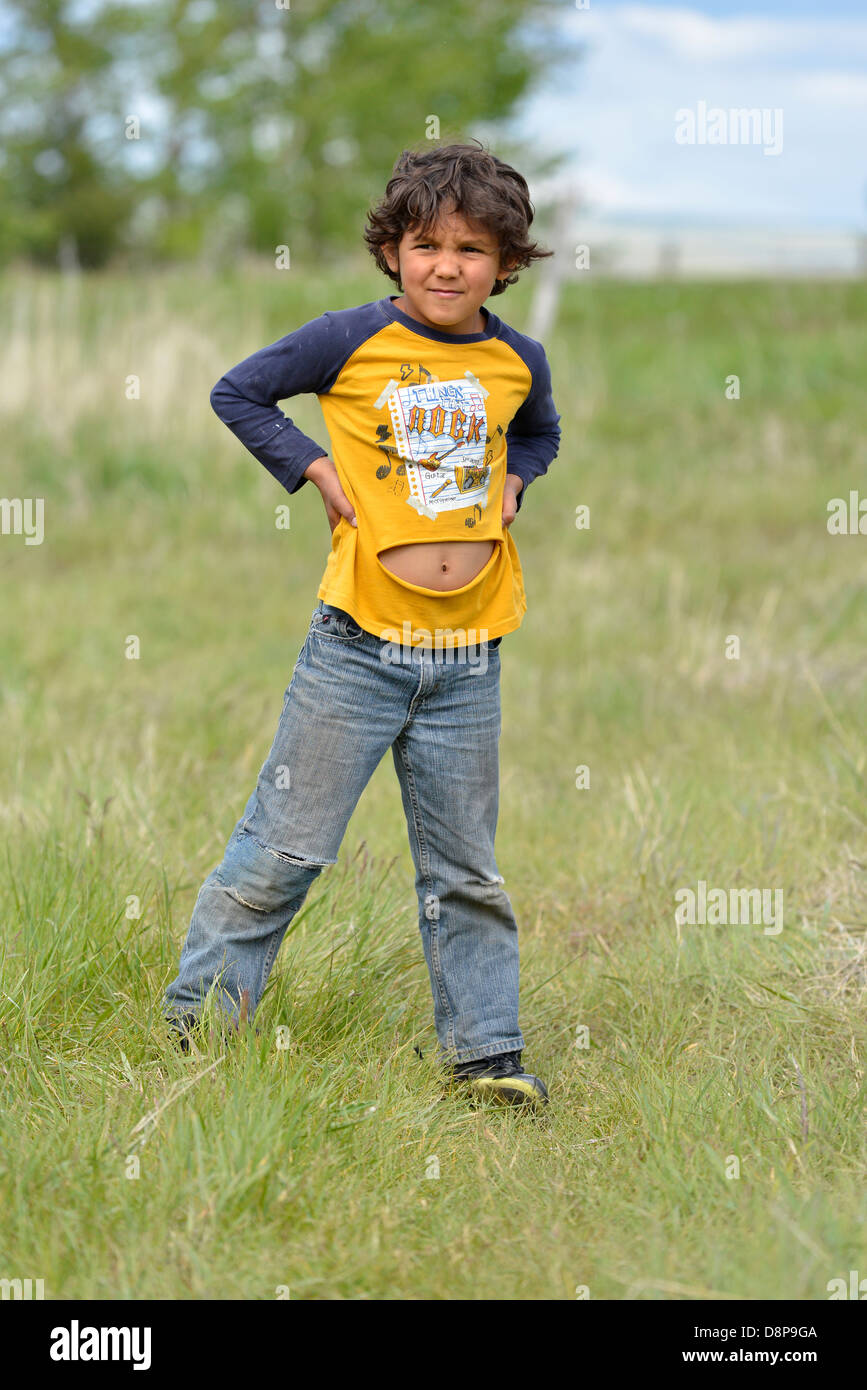 Young Boy With His Belly Showing Through A Tear In His Shirt Wallowa Young Boy With His Belly Showing Through A Tear In His Shirt Wallowa