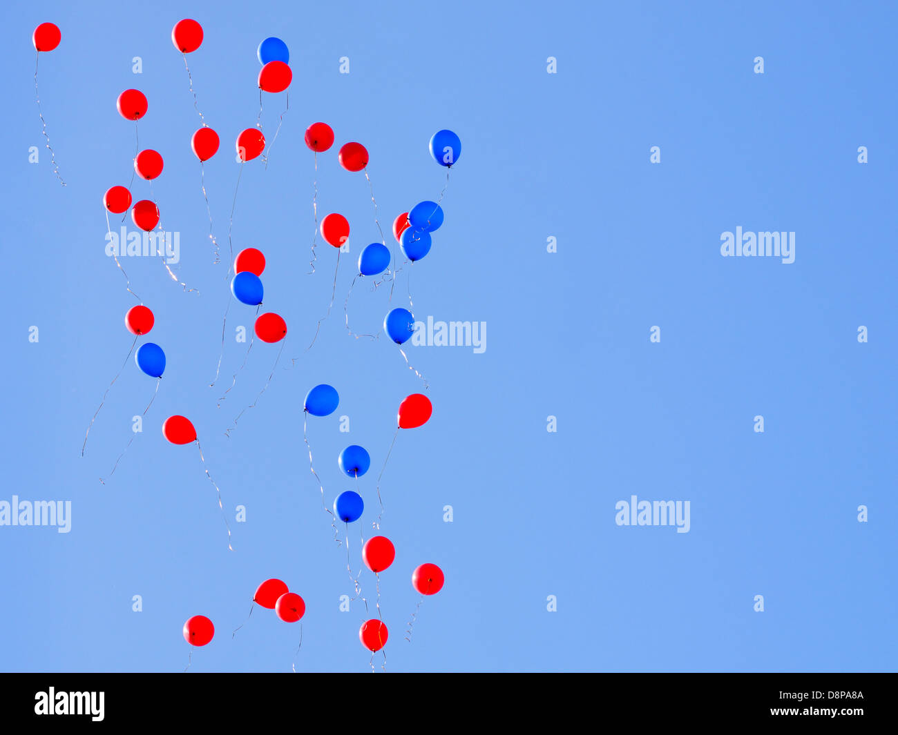 Colorful balloons flying in blue sky Stock Photo - Alamy