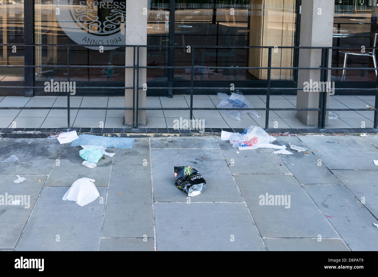 Litter on UK street pavement Stock Photo - Alamy