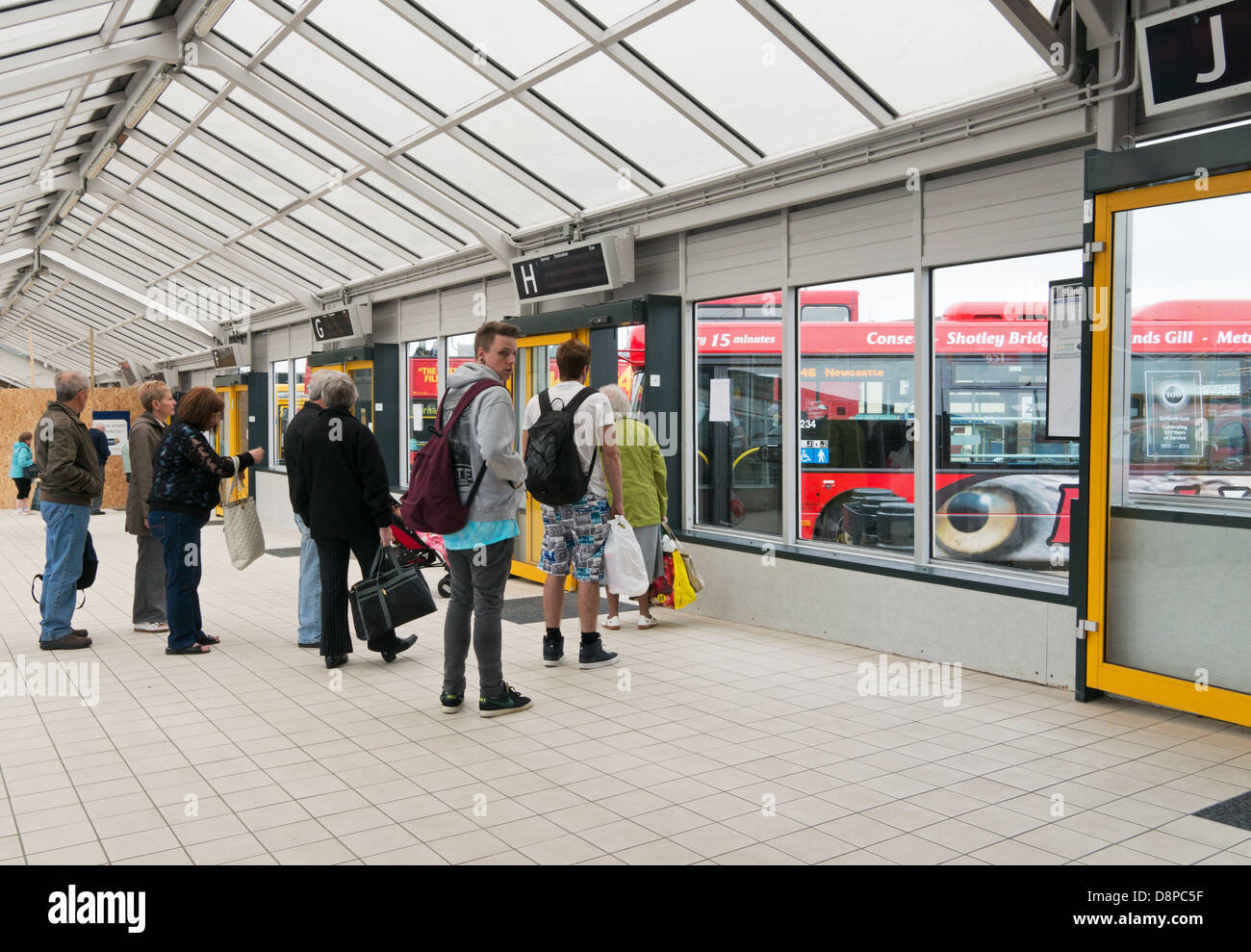 People queuing inside Consett bus station, north east England UK Stock ...