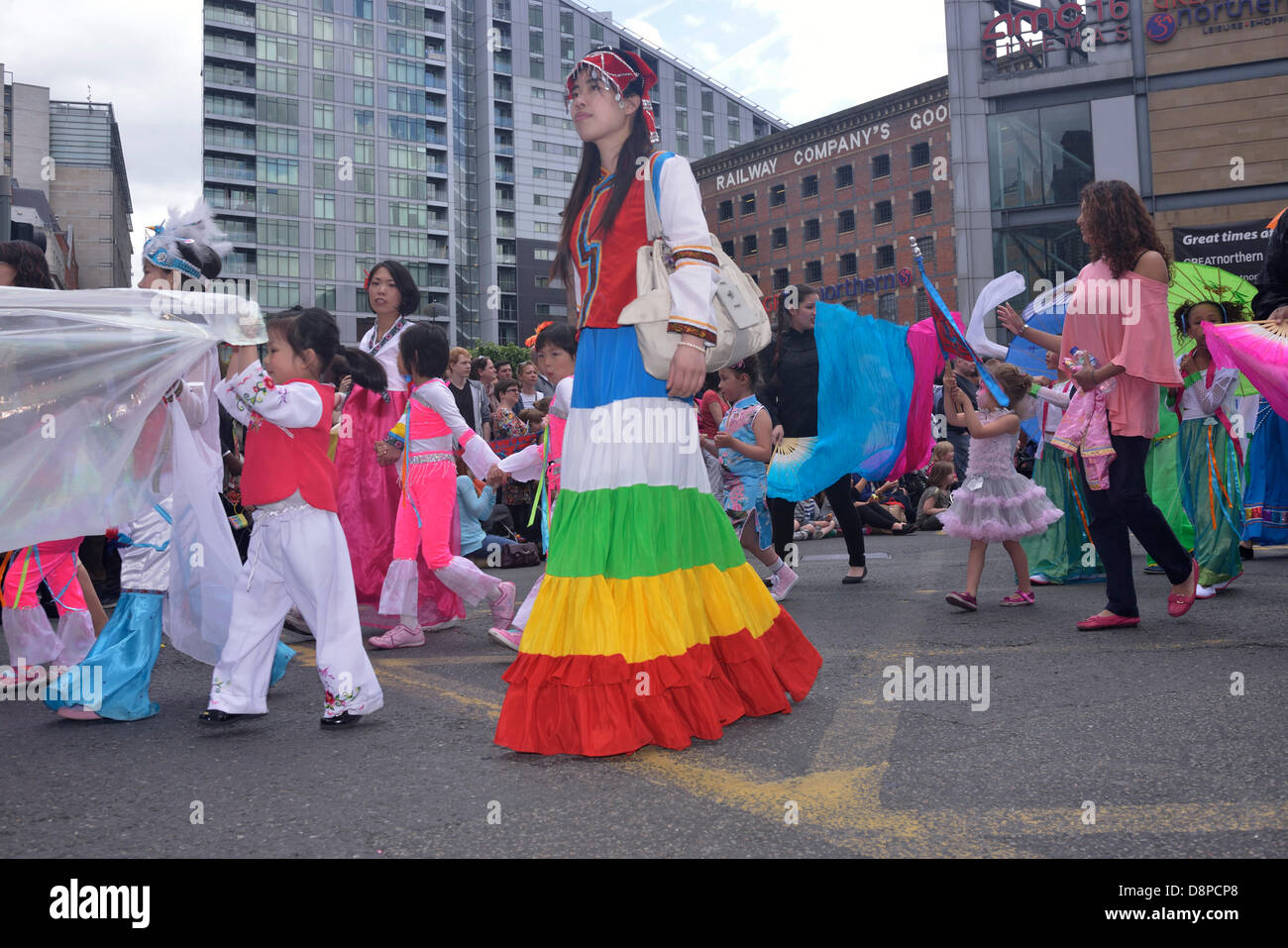 02 June 2013 Manchester, UK A girl in oriental dress walks in the ...