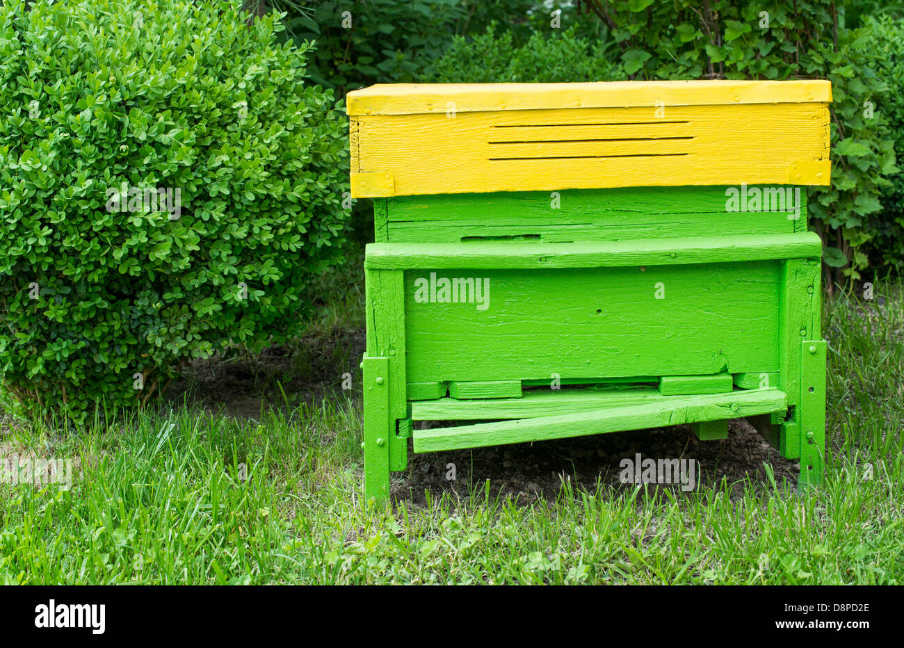 Green beehive located on the green lawn Stock Photo - Alamy
