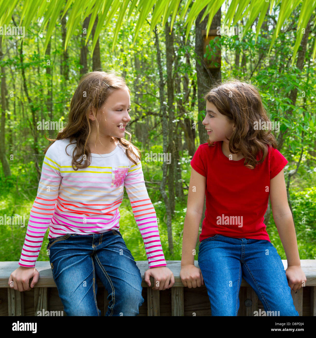 Children sister friends talking relaxed hi-res stock photography and ...